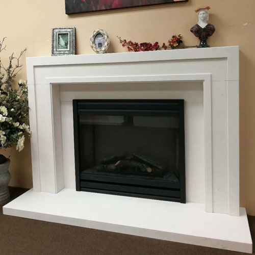 modern marble fireplace mantel with a groove running around the front face